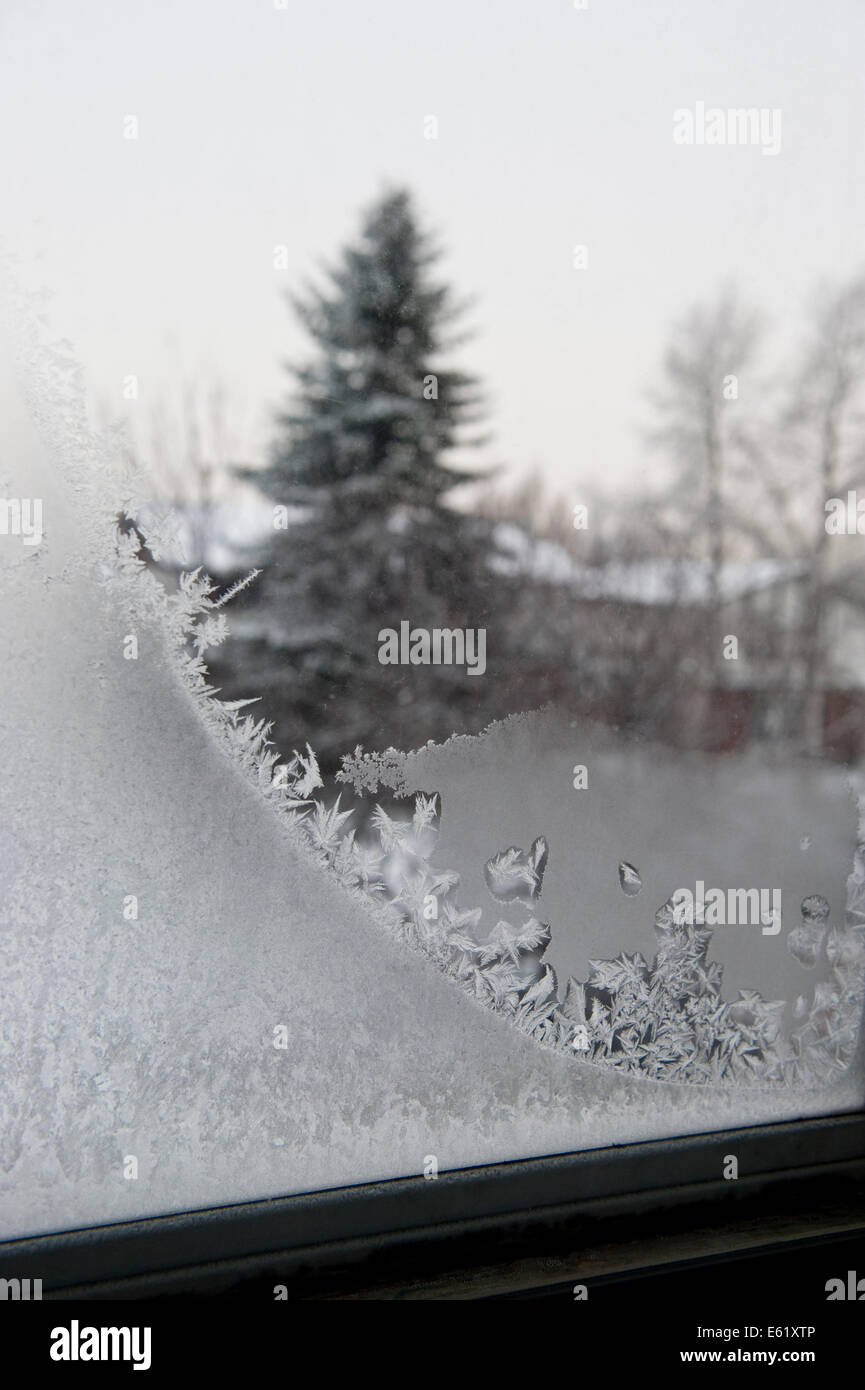 Urban winter morning sunrise from a frosty window Stock Photo - Alamy