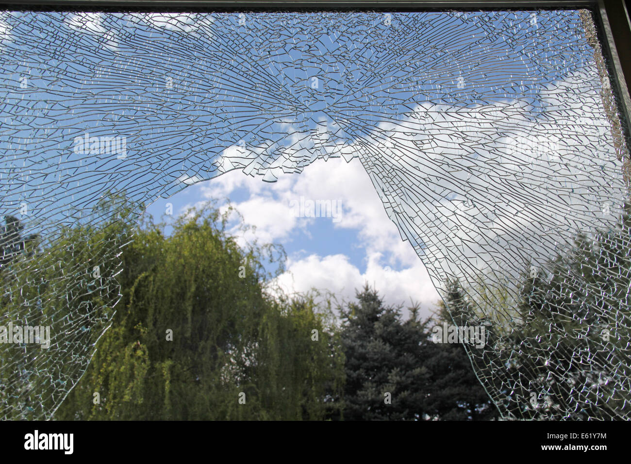 Glass Window Broken into a Million Pieces Stock Photo - Alamy