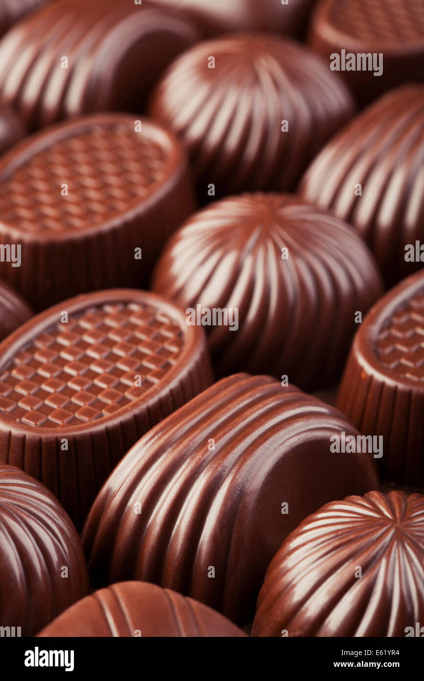 Assorted delicious chocolate candies background Stock Photo - Alamy