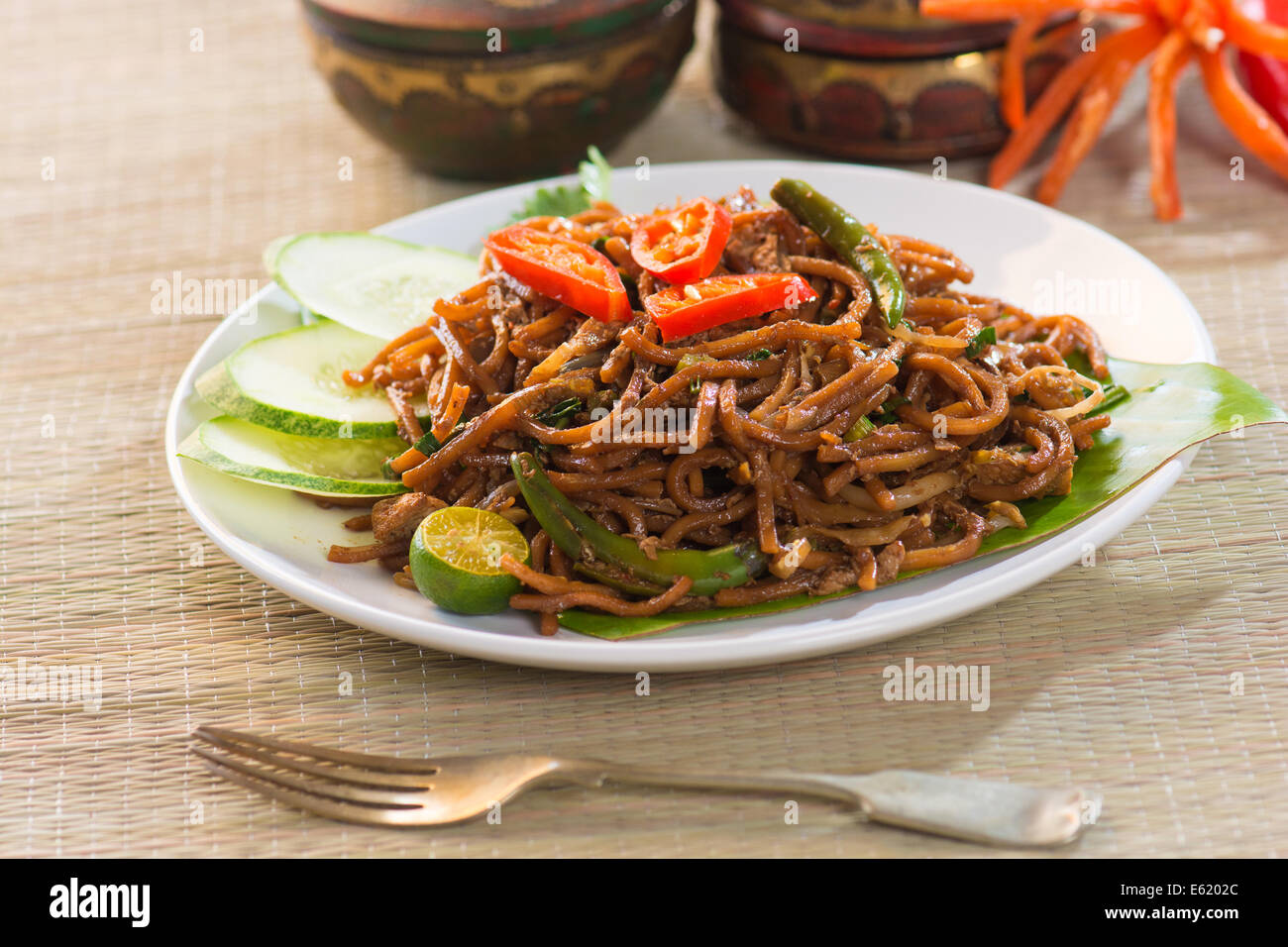 fried noodle with traditioal background Stock Photo - Alamy