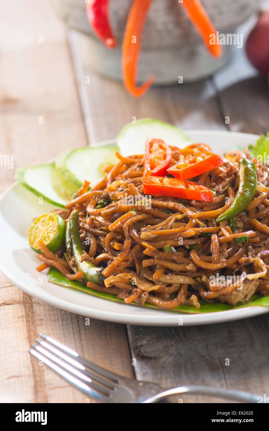 fried noodle with traditioal background Stock Photo - Alamy