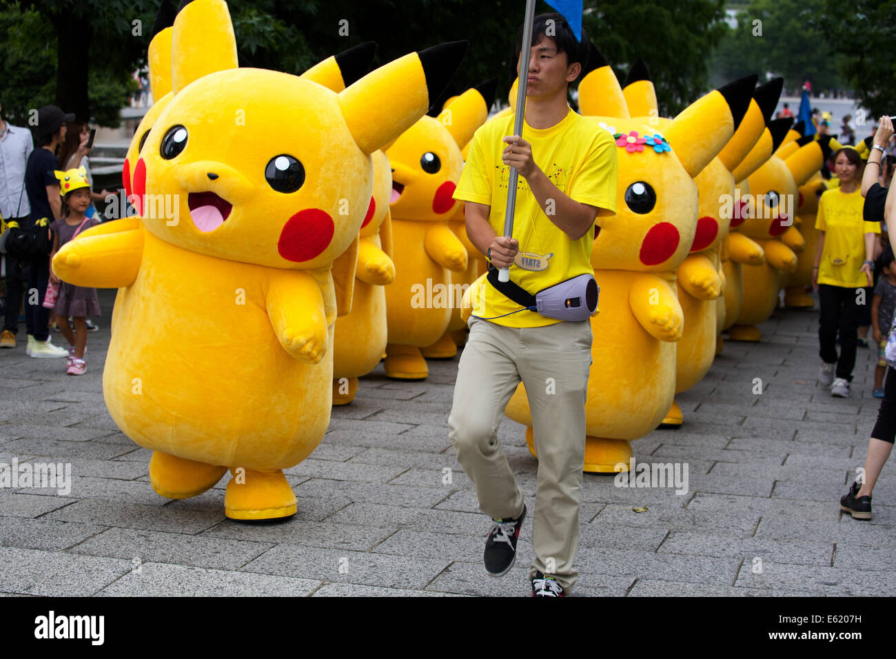 20 Pikachus march on the street during the parade at the "1000 Pikachu ...