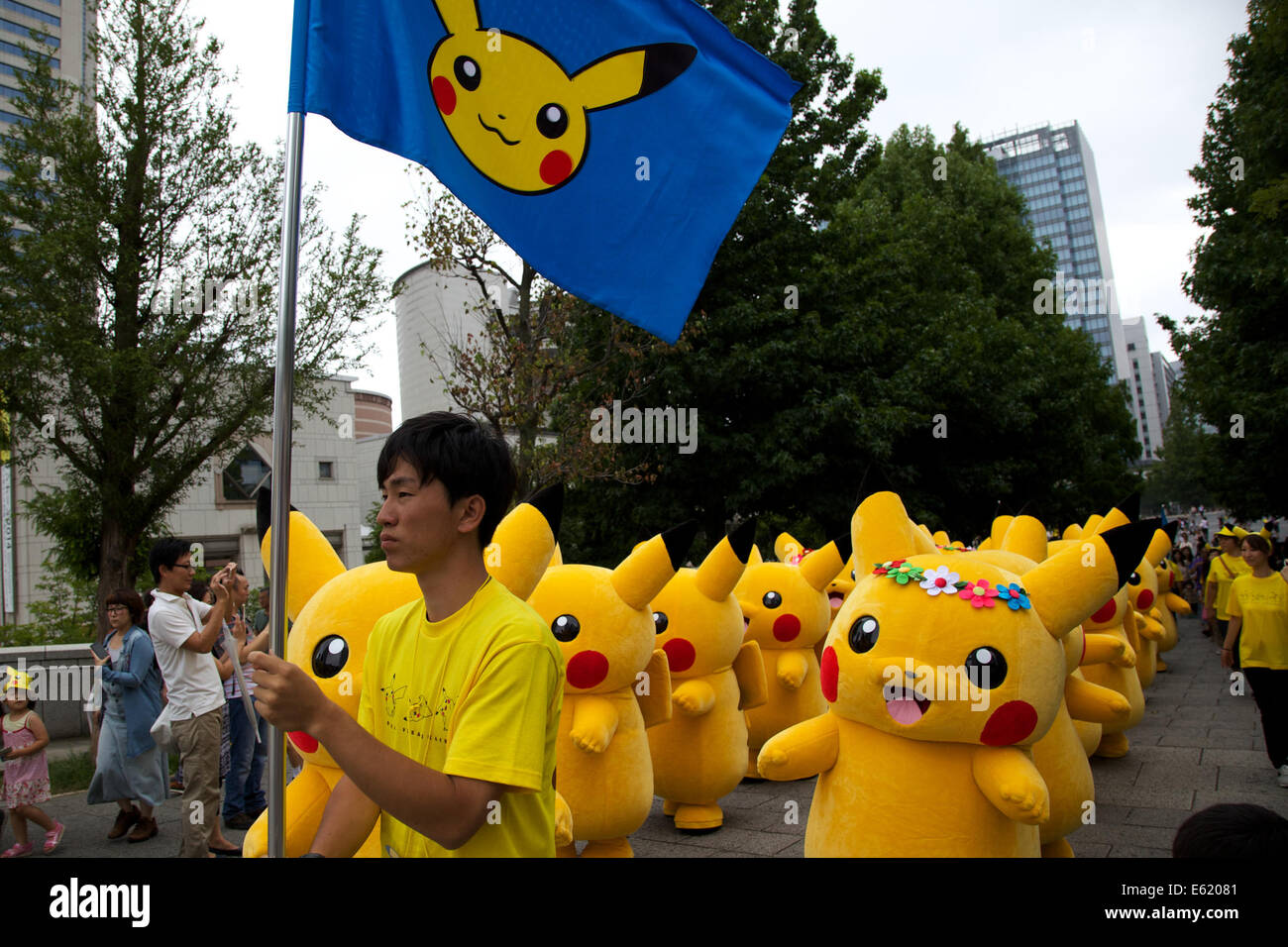 20 Pikachus march on the street during the parade at the "1000 Pikachu ...