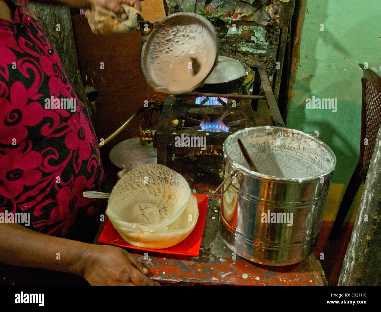 Woman cooking traditional appa pancakes in Sri Lanka Stock Photo - Alamy