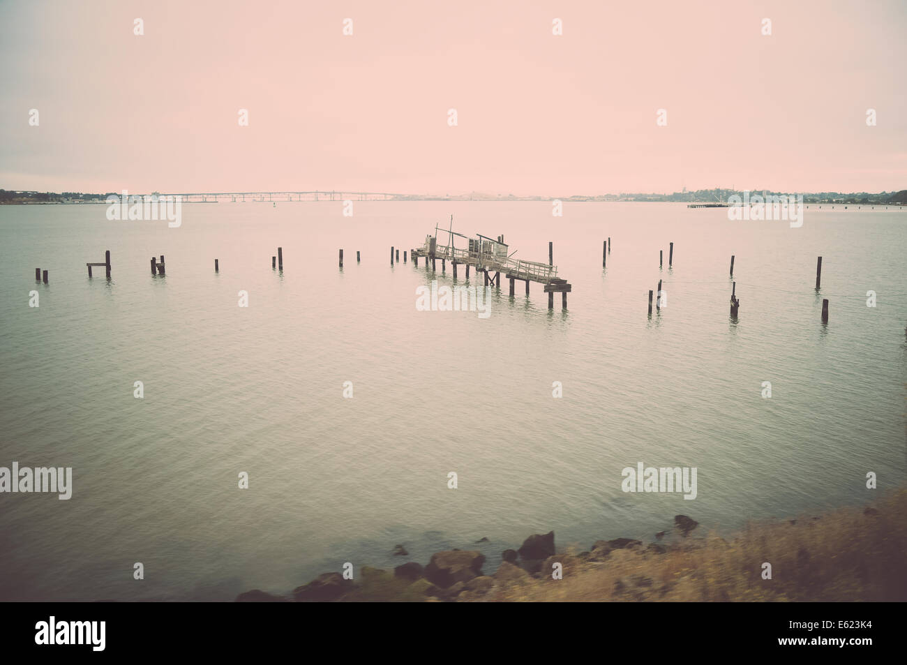 Cloudy ocean landscape with old broken dock in the San Francisco bay ...