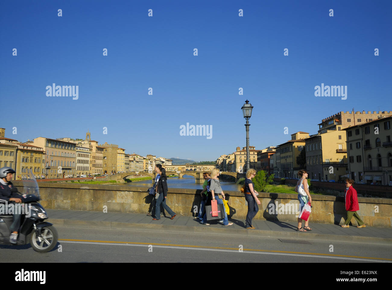 pedestrians on bridge over River Arno, Florence or Firenze, Italy Stock ...