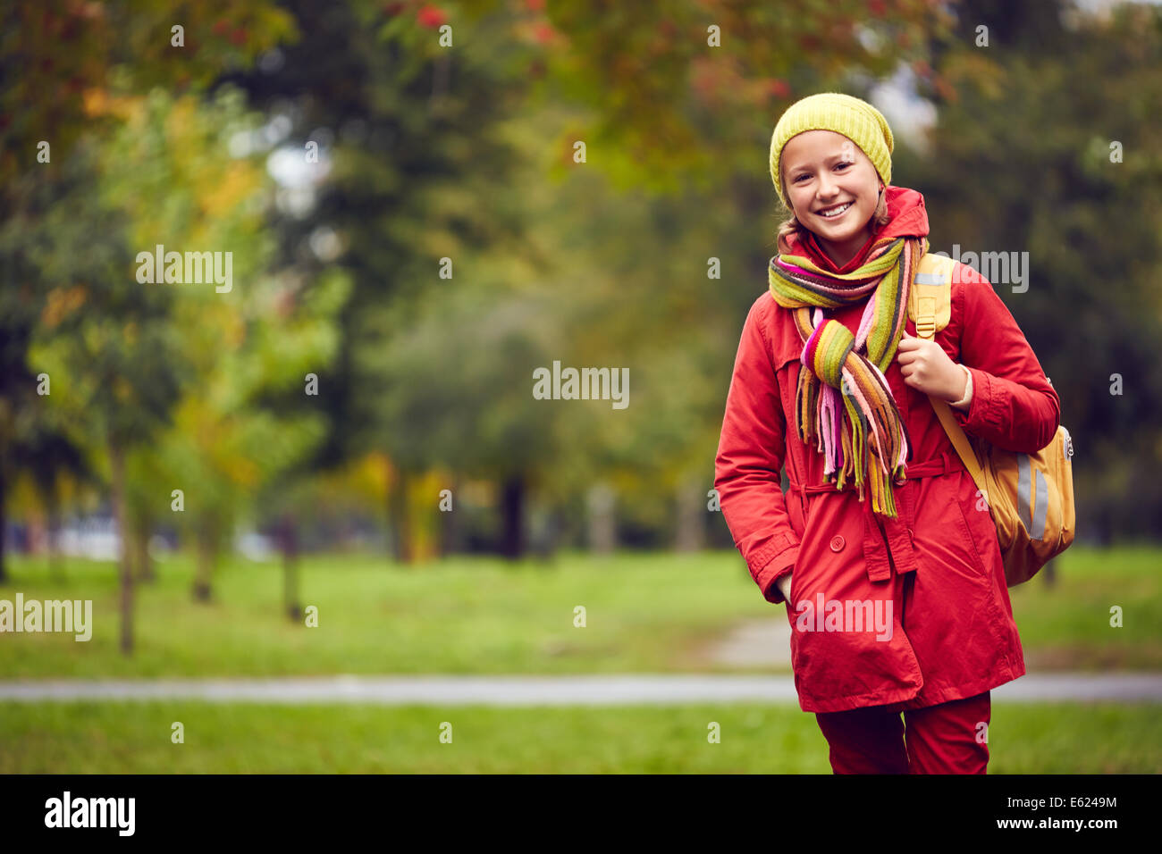 Portrait of happy schoolgirl looking at camera in park Stock Photo - Alamy