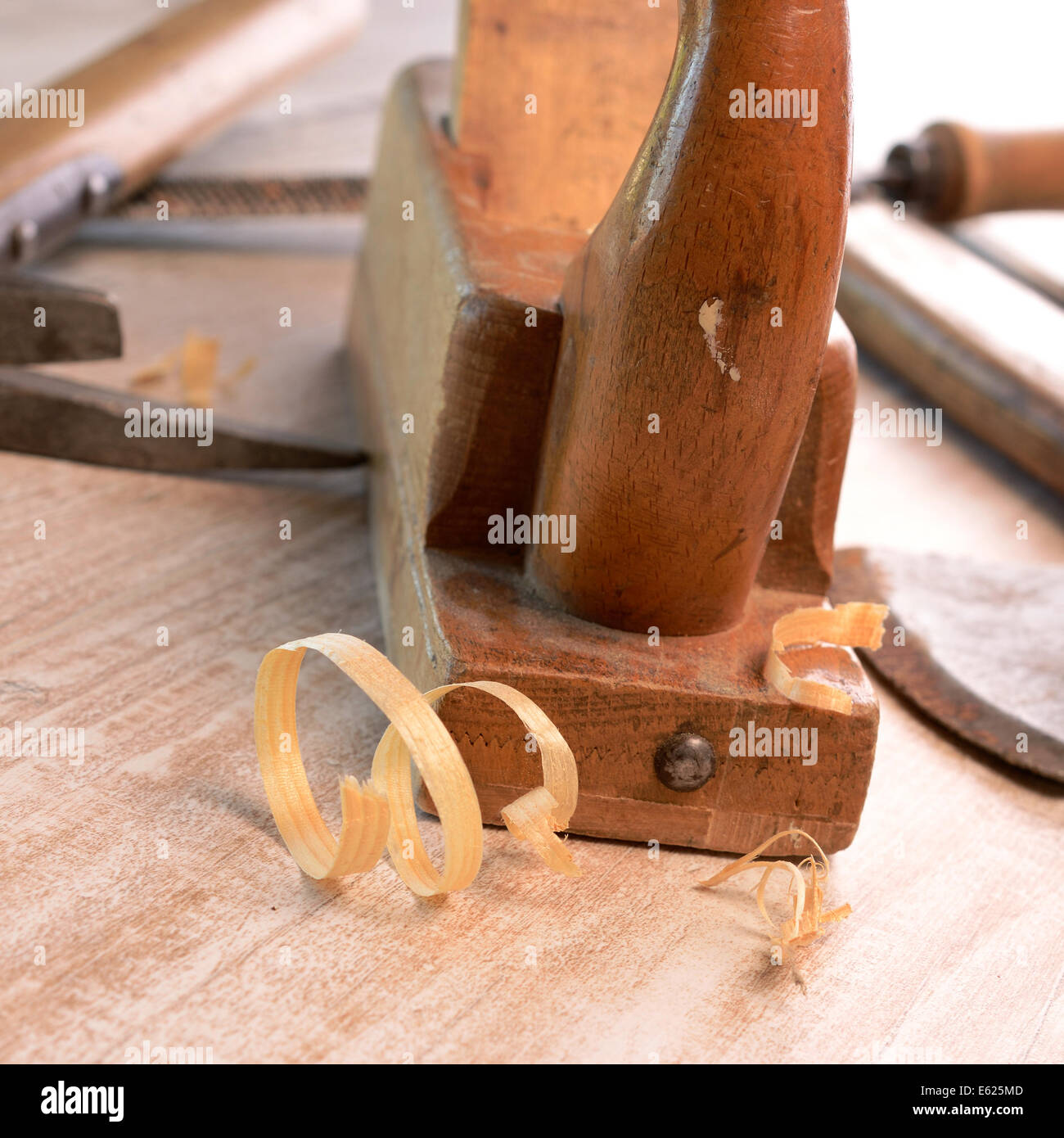 Old used carpenter tools on a wooden background Stock Photo - Alamy