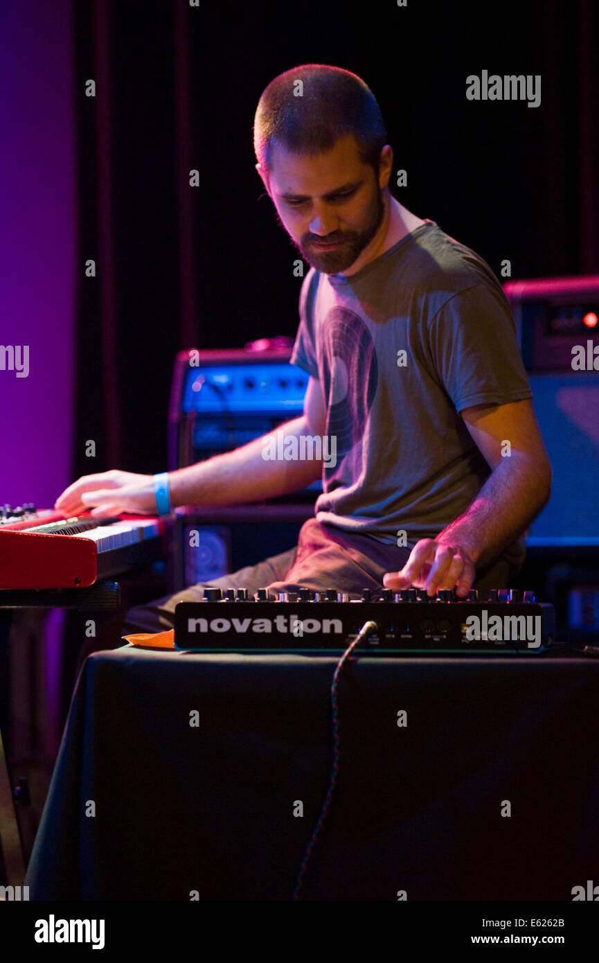 Kit Downes keyboards with Troyka jazz trio performing on stage at ...
