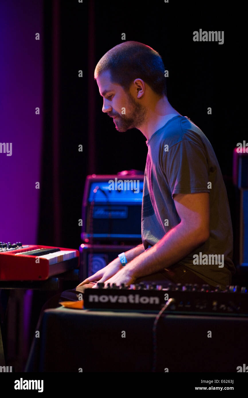 Kit Downes keyboards with Troyka jazz trio performing on stage at ...