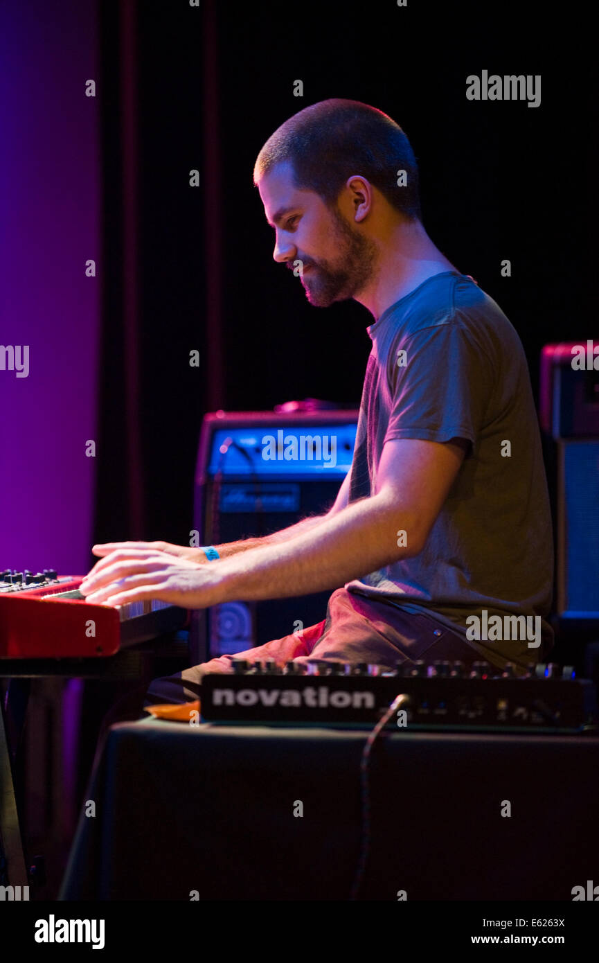 Kit Downes keyboards with Troyka jazz trio performing on stage at ...