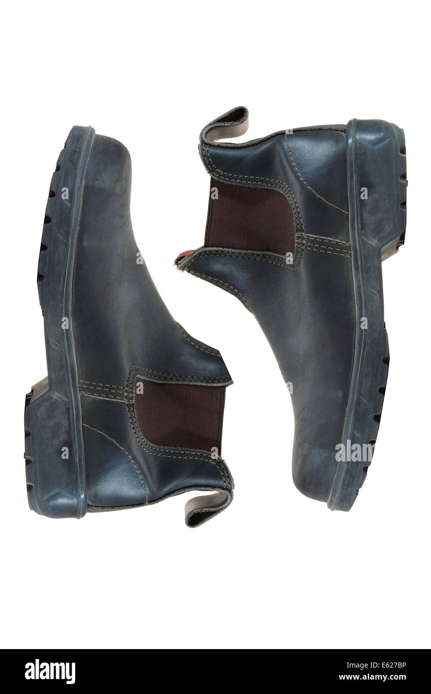 A close up shot of work boots Stock Photo - Alamy