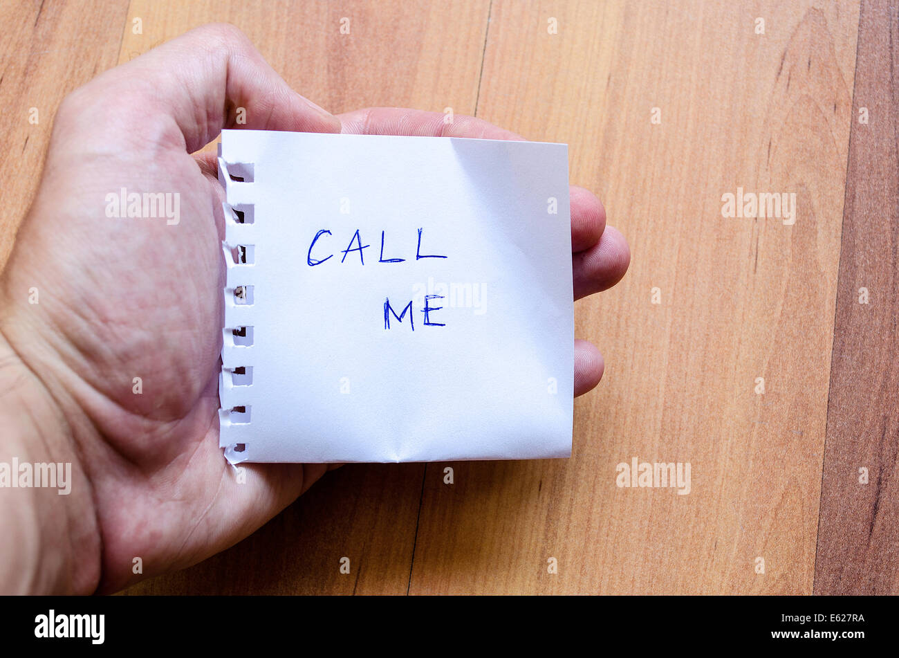 Call Me Note in a human hand Stock Photo - Alamy
