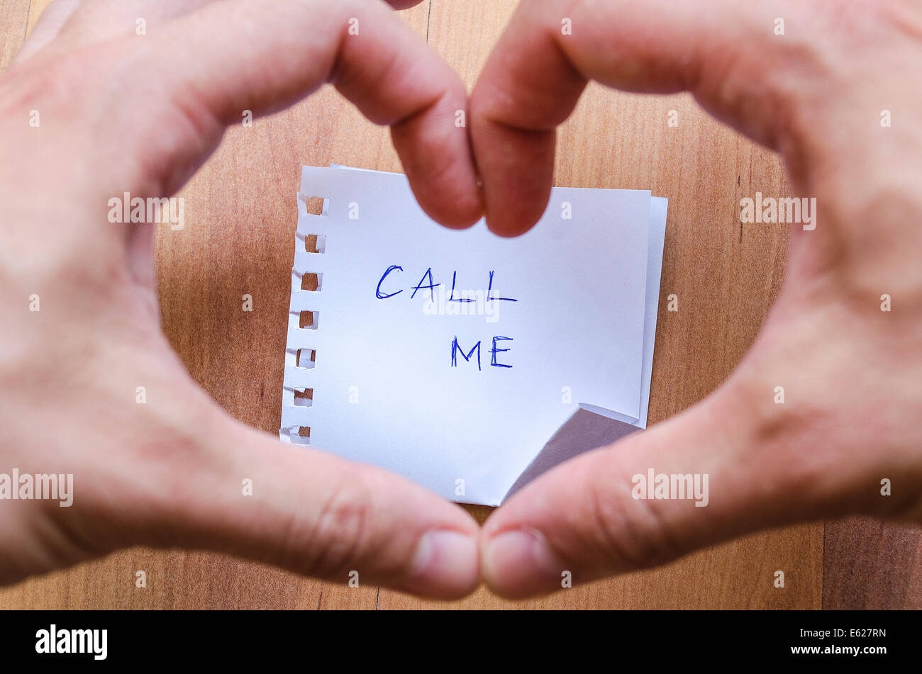Call Me Note in a human hand Stock Photo - Alamy