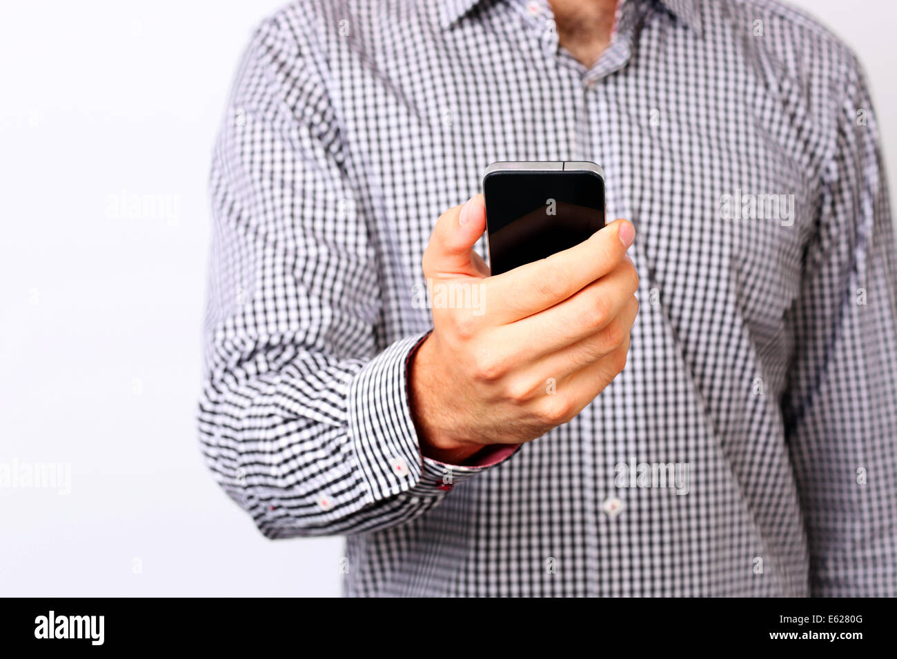 Closeup portrait of a male hand using smartphone Stock Photo - Alamy