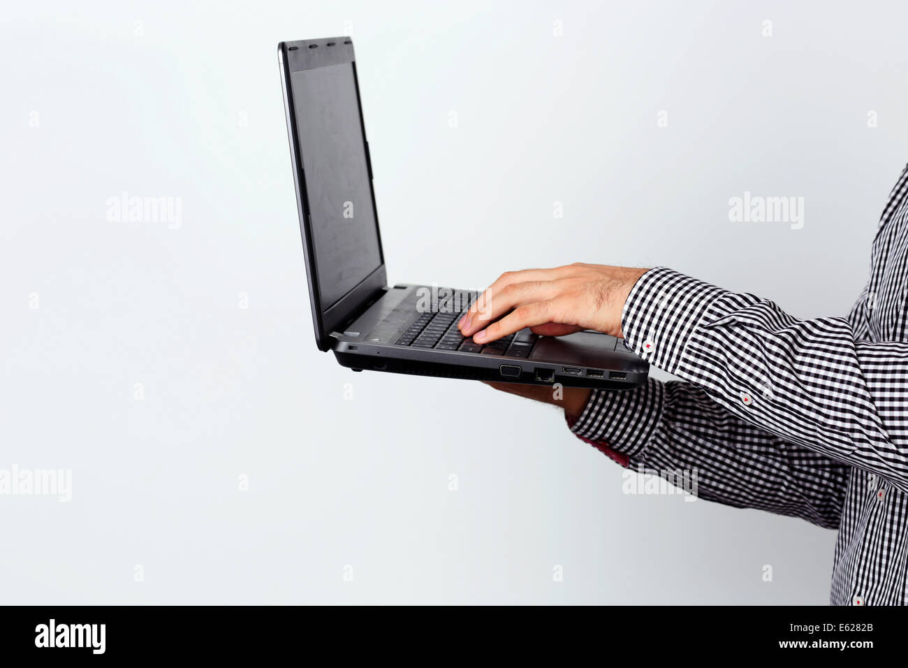 Side view portrait of a man using laptop Stock Photo - Alamy
