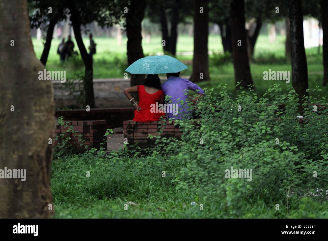 Dhaka 2014. A Couple spending time in Ramna Park in Dhaka. Bangladesh ...
