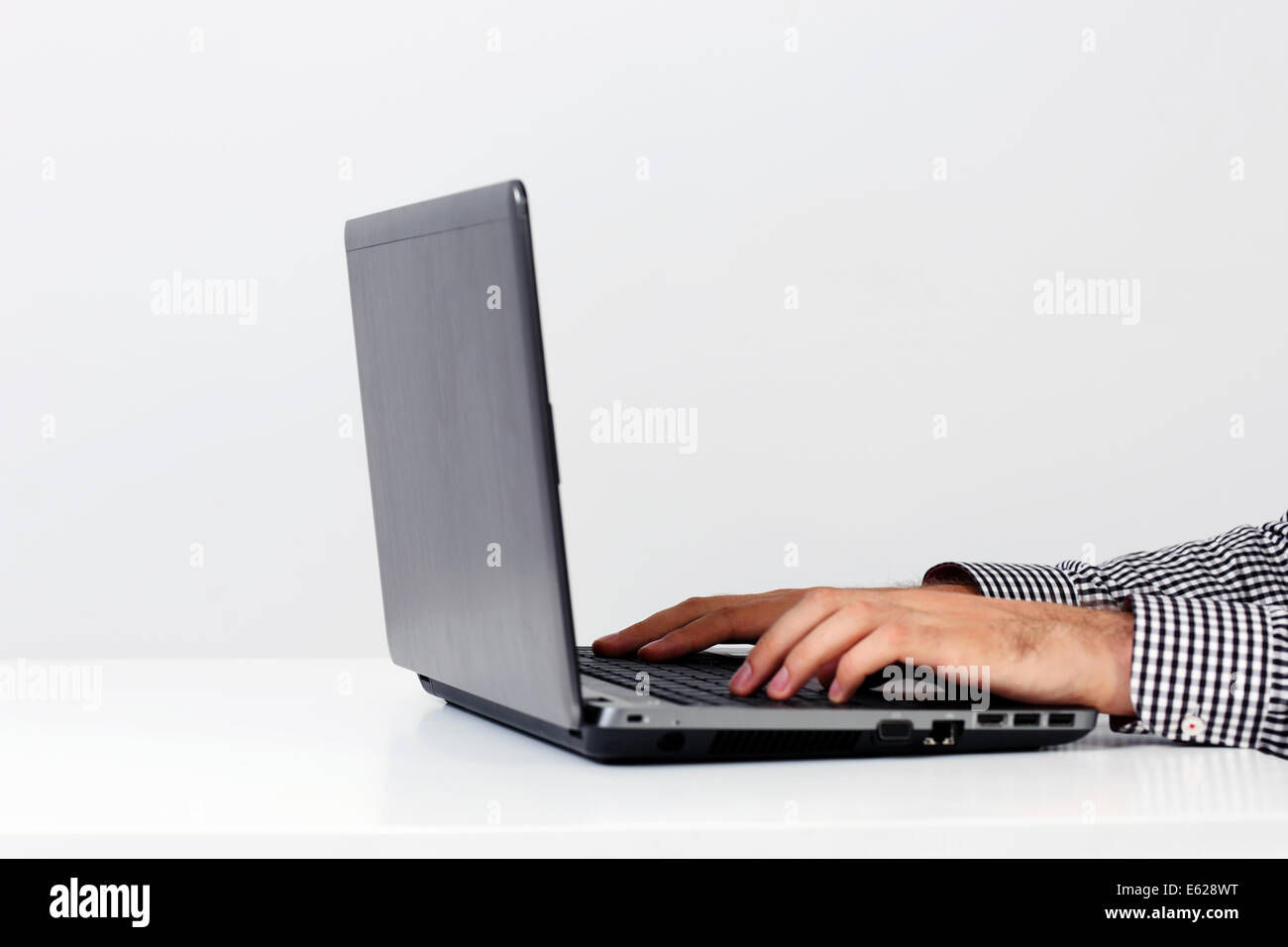 Closeup portrait of a male hands using on the laptop Stock Photo - Alamy