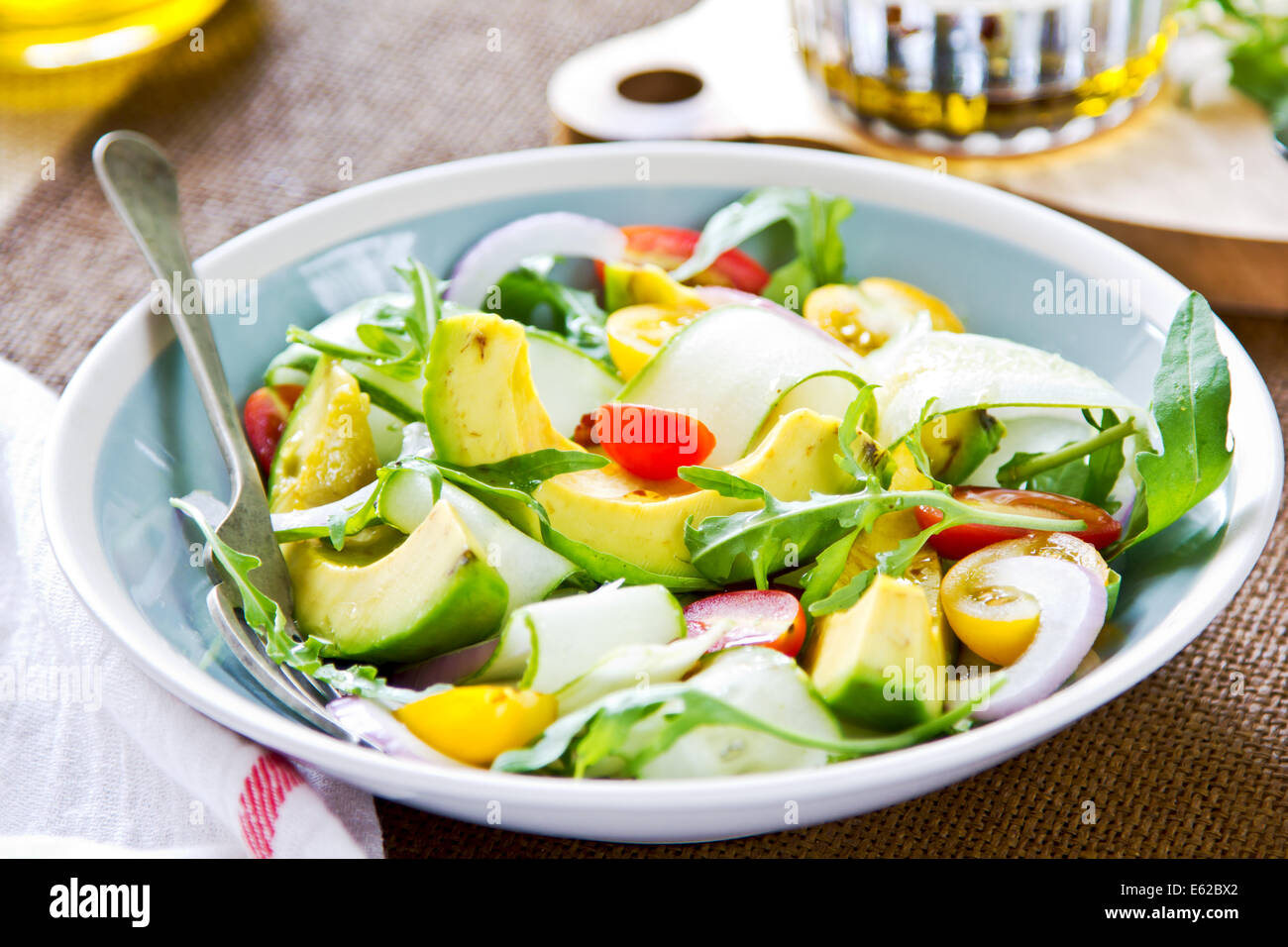 Avocado with Cucumber and Rocket salad by Balsamic dressing Stock Photo ...