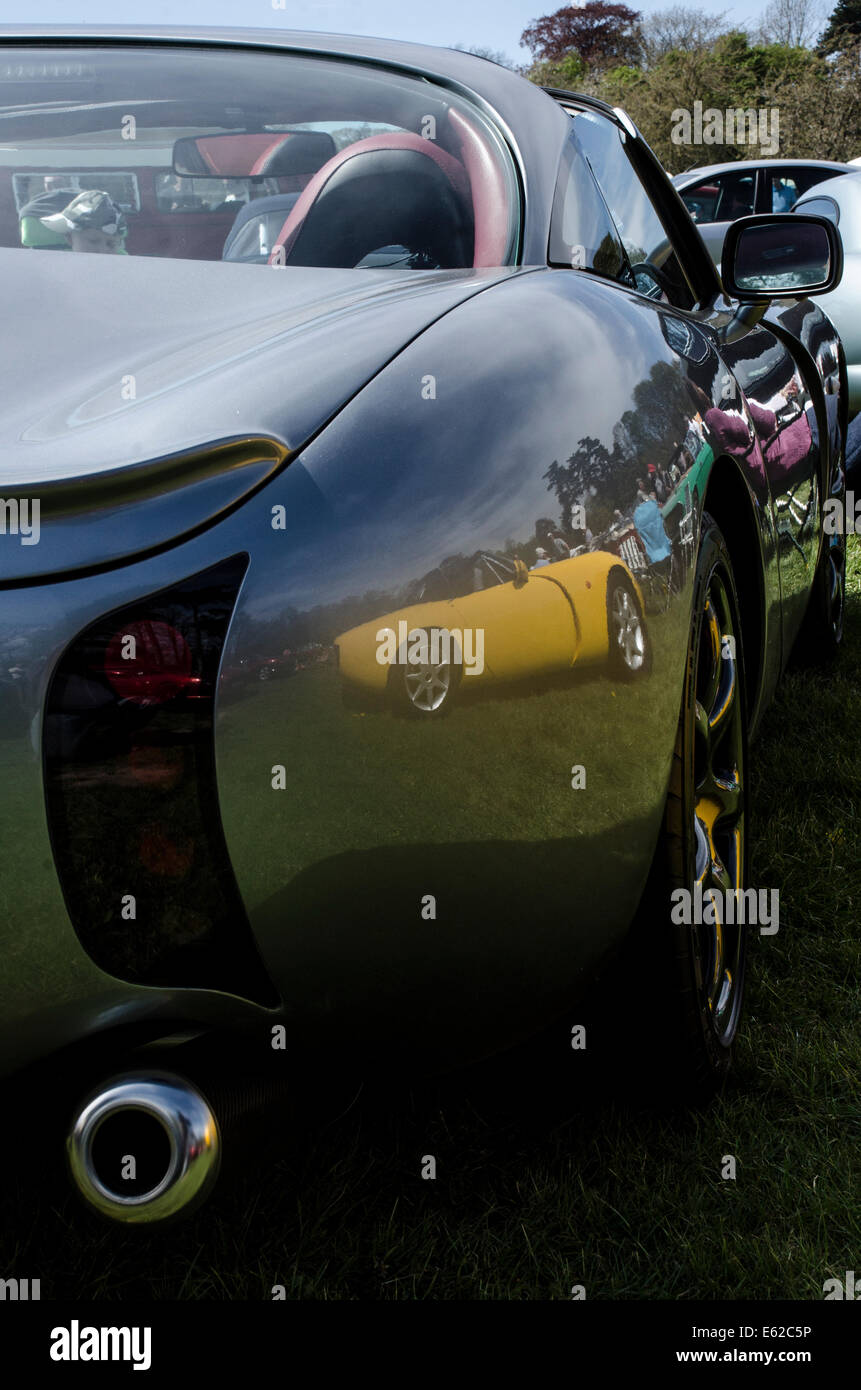 Yellow TVR reflected in TVR paint Stock Photo - Alamy