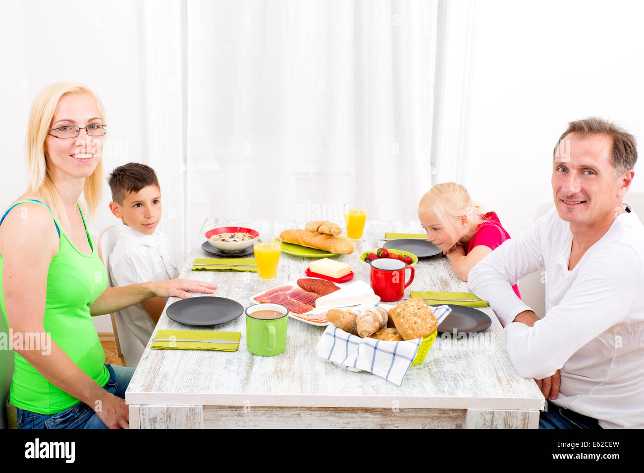 A family having breakfast at home Stock Photo - Alamy