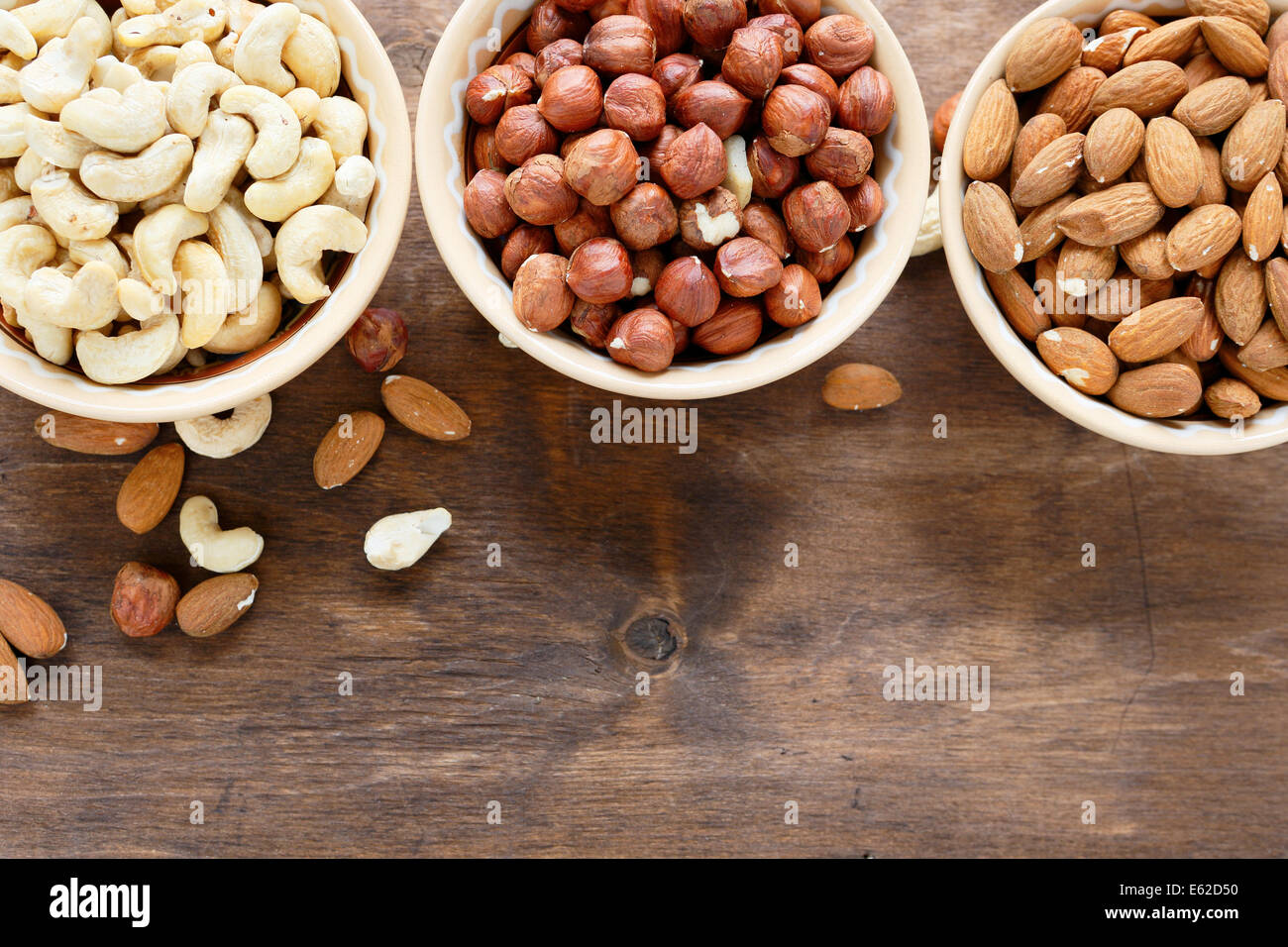 different nuts in bowls, top view, food closeup Stock Photo - Alamy