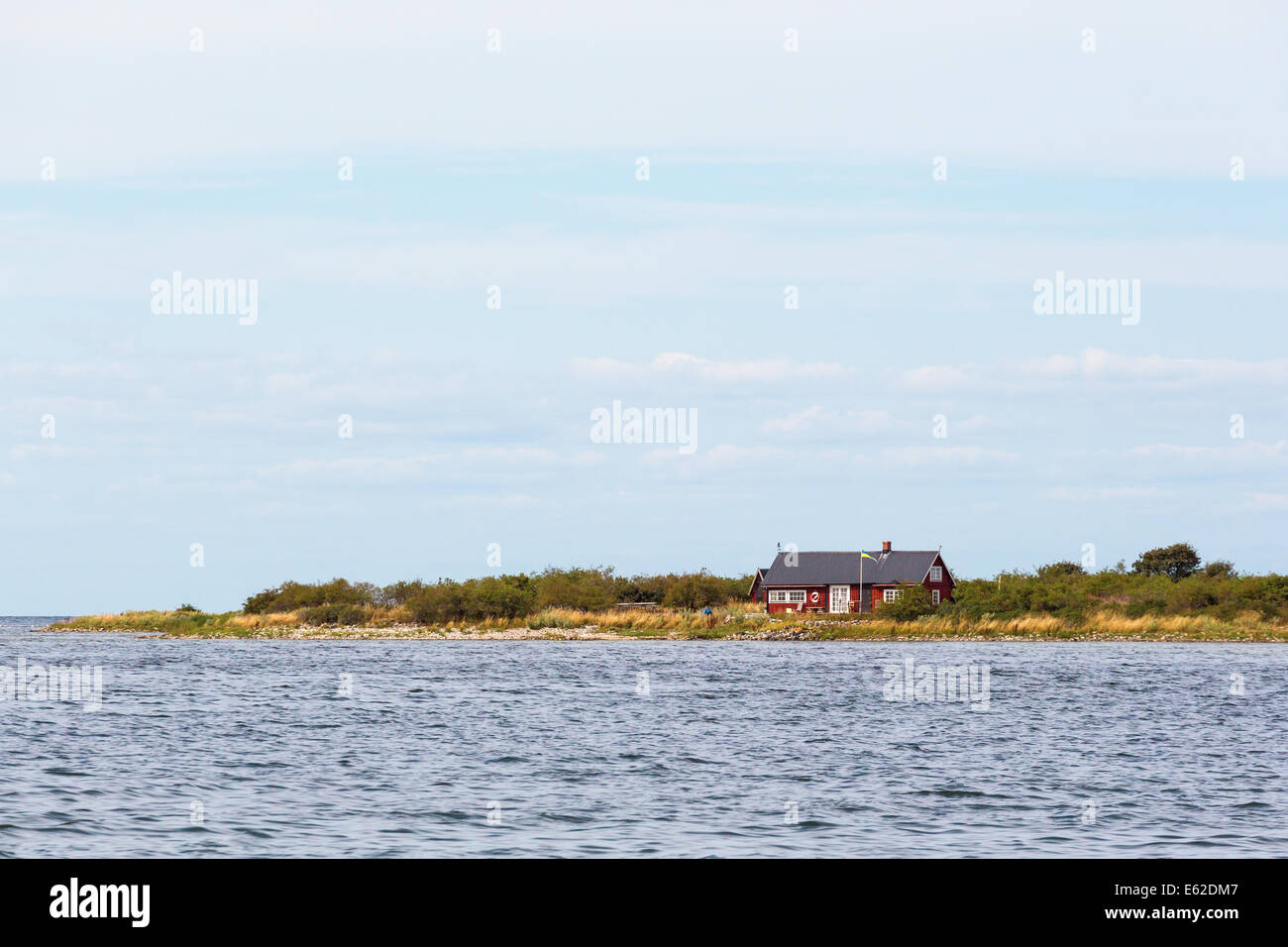 Red summer cottage at the sea beach Stock Photo - Alamy