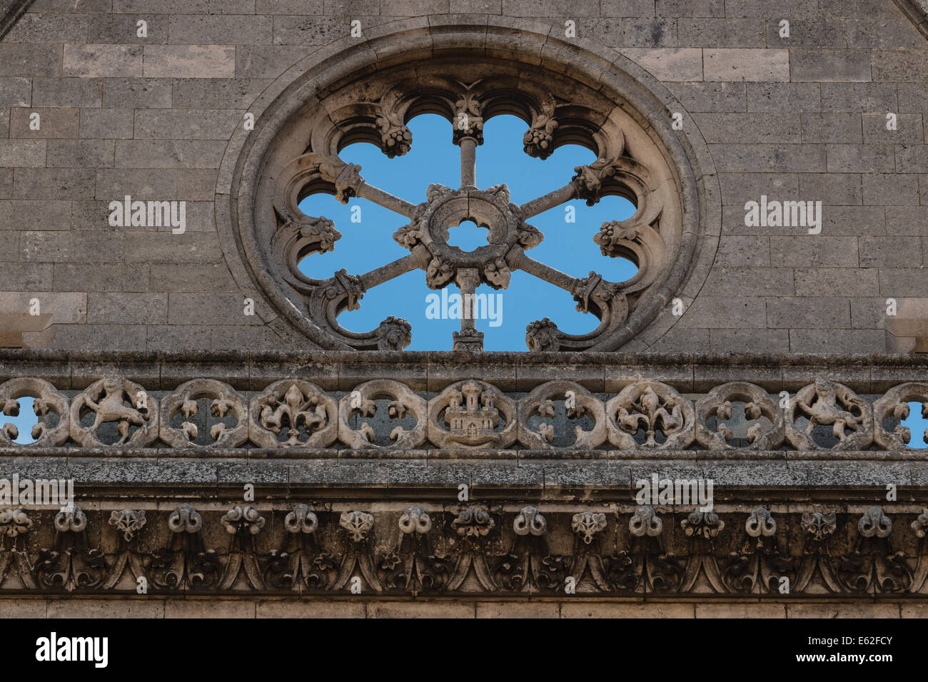 Stoned rose window and balustrade in main facade of gothic leon ...
