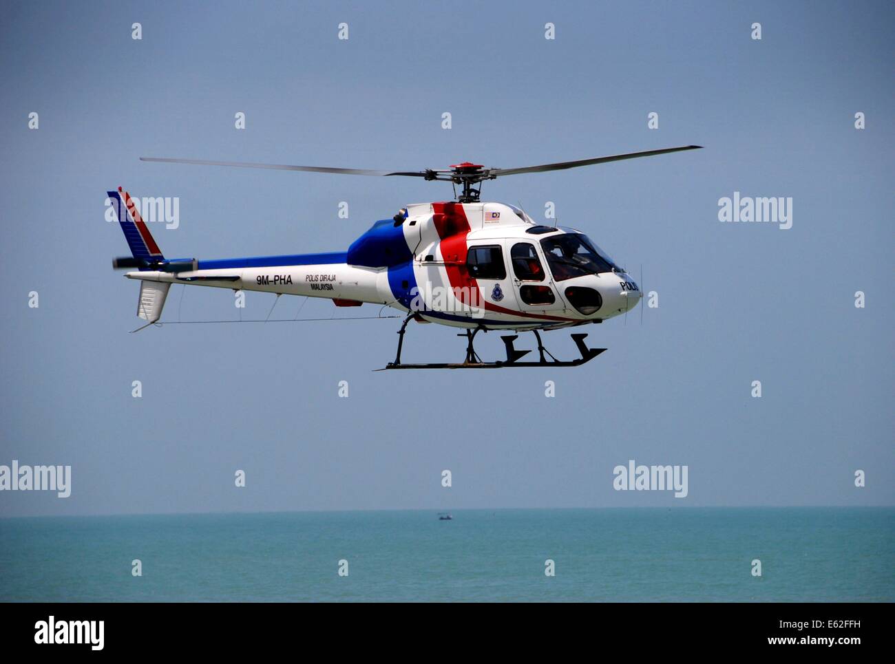 BATU FERRINGHI (PENANG), MALAYSIA: A Malaysian helicopter hovers over ...
