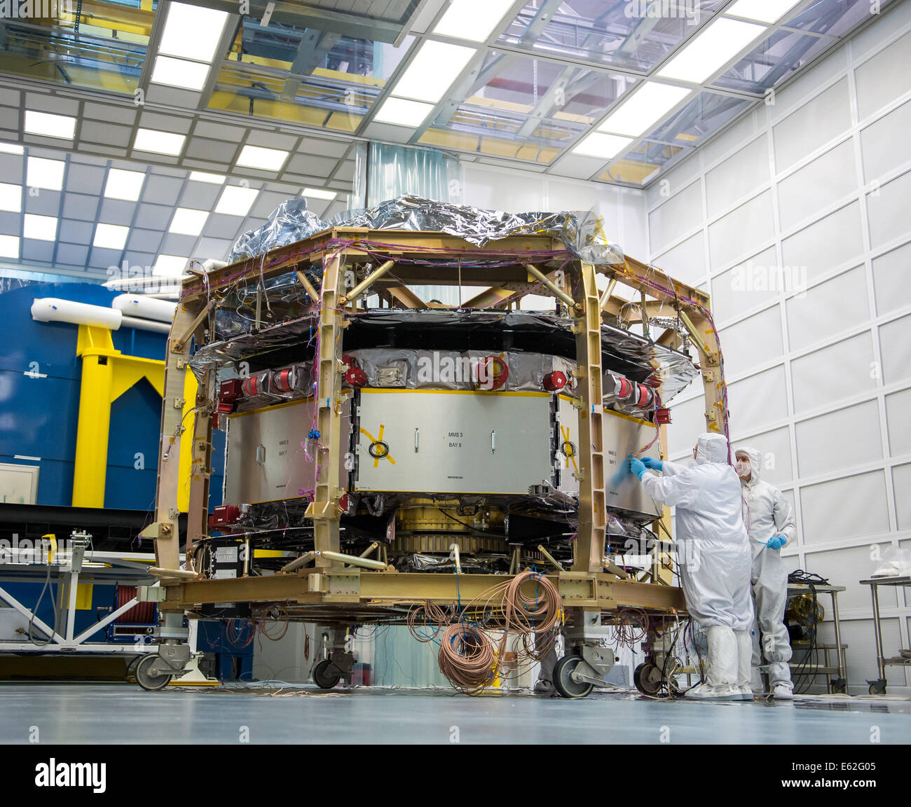 Engineers work on one of four Magnetospheric Multiscale (MMS ...