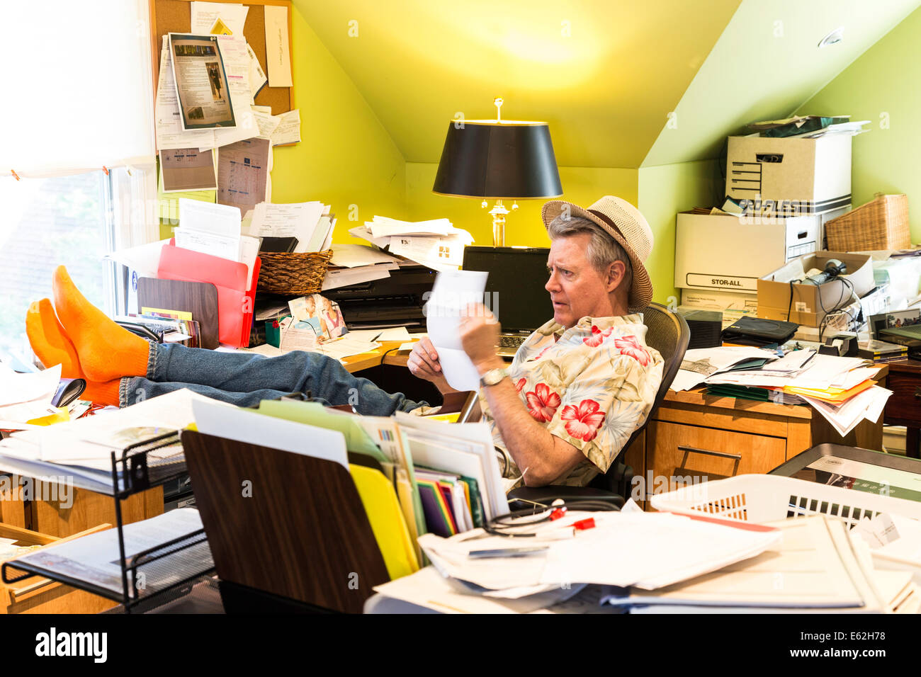 Businessman in Hoarders' Messy Home Office, USA Stock Photo - Alamy