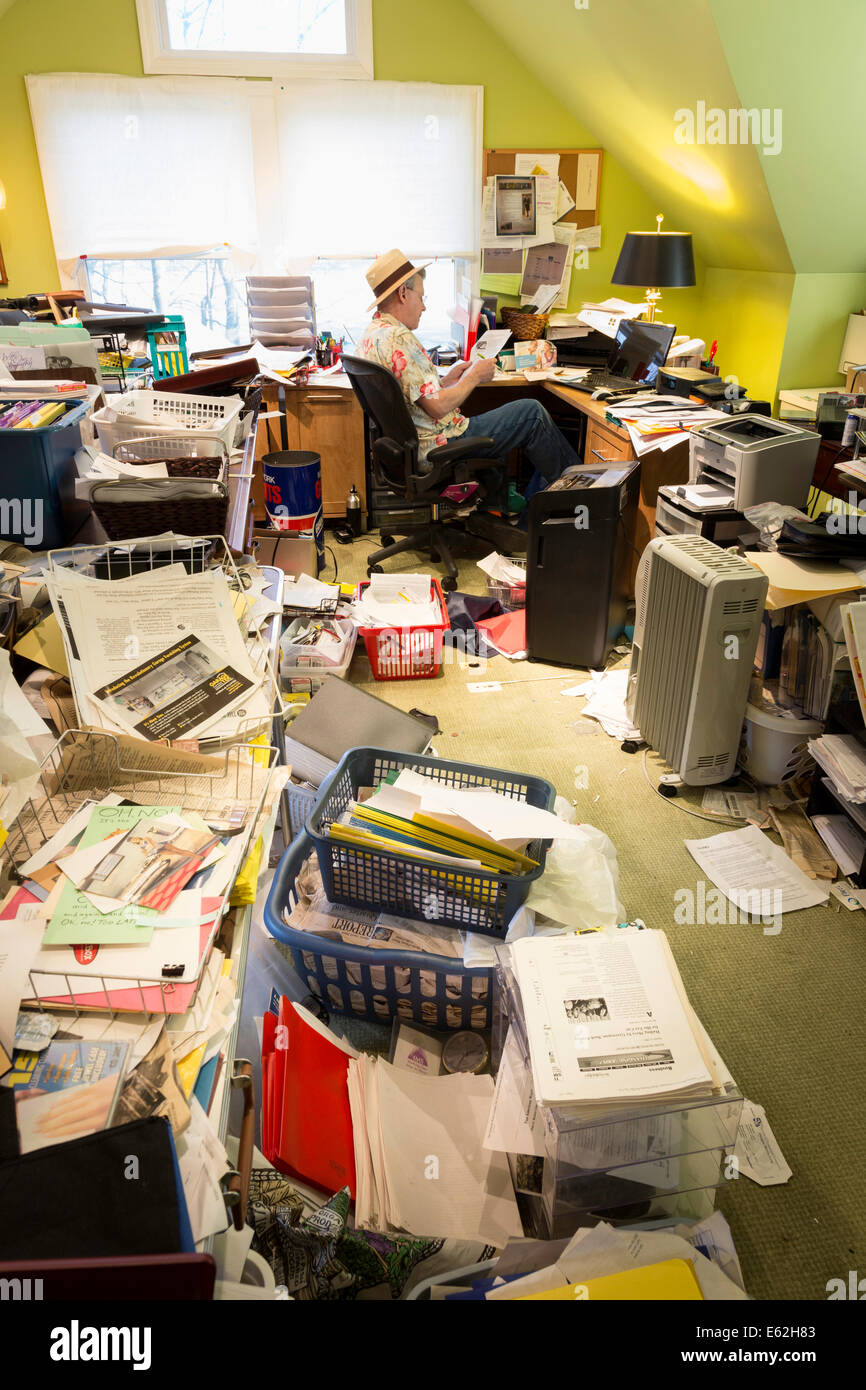 Businessman in Hoarders' Messy Home Office, USA Stock Photo - Alamy