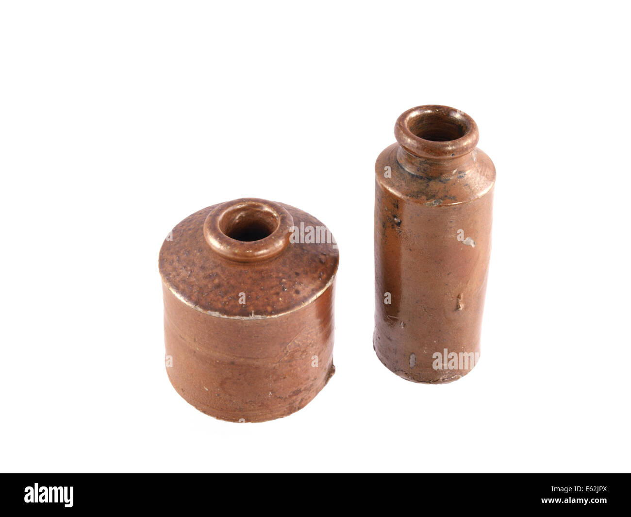 Vintage clay ink wells on a white background Stock Photo - Alamy