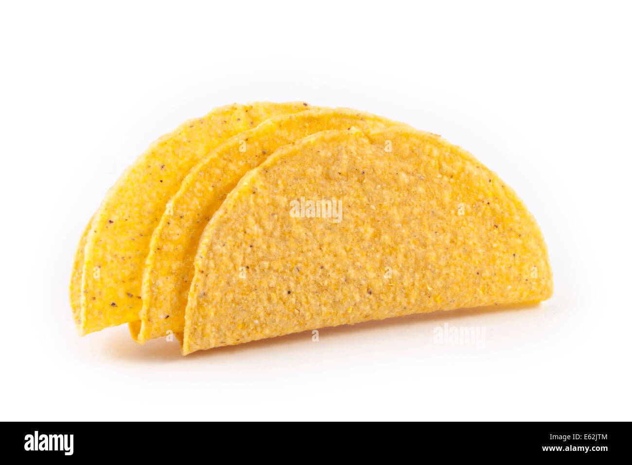 Three crispy taco shells on white background Stock Photo - Alamy