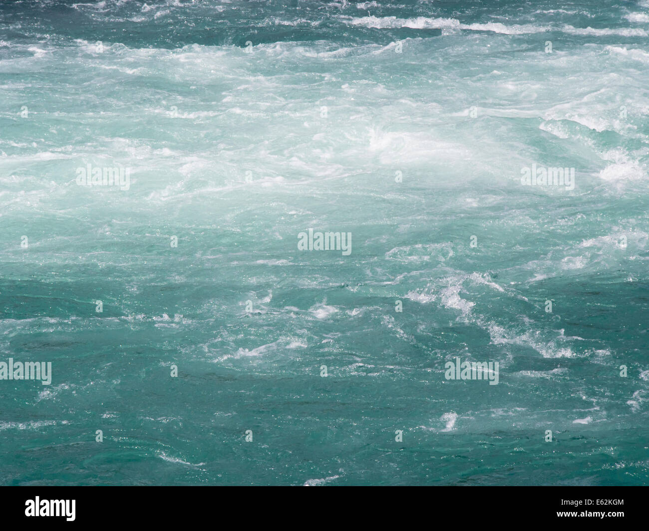 Close up of fresh, clean, rushing river water, ice blue coming from ...