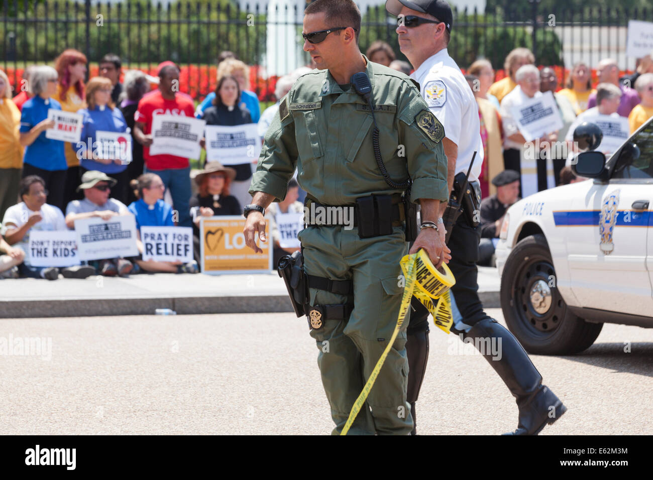US Park Police SWAT policeman with police line tape during protest at ...