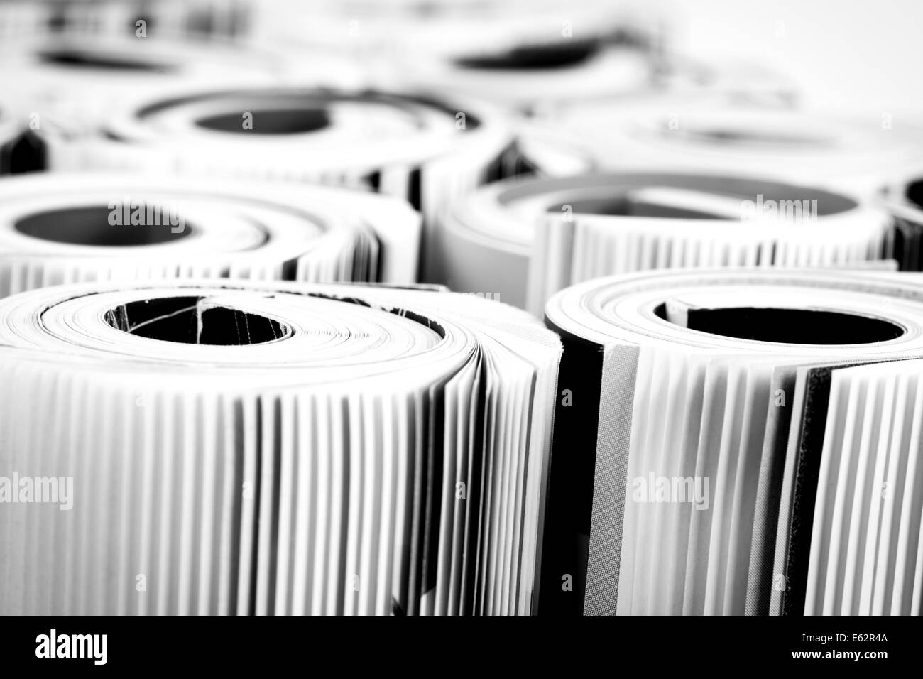 Colorful magazines up close - rolled up composition Stock Photo - Alamy