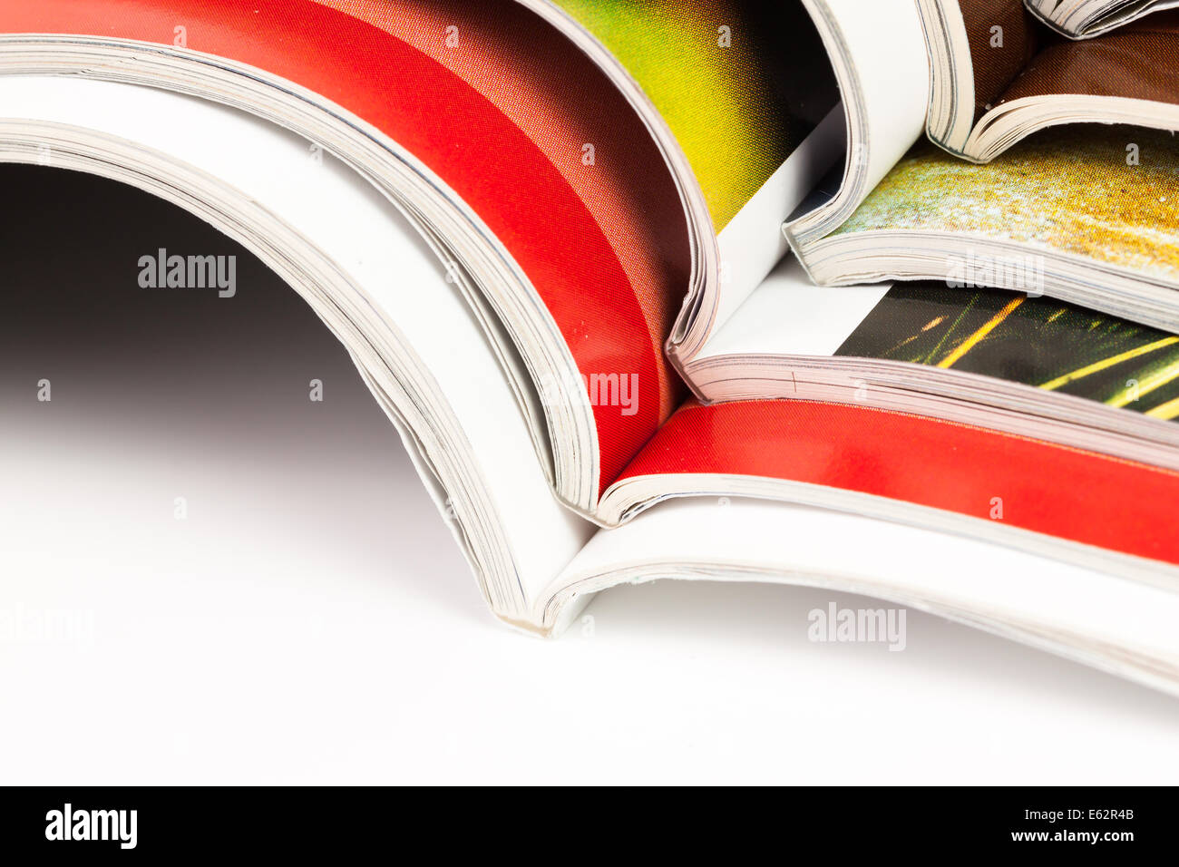 Stack of color magazines on white background Stock Photo - Alamy