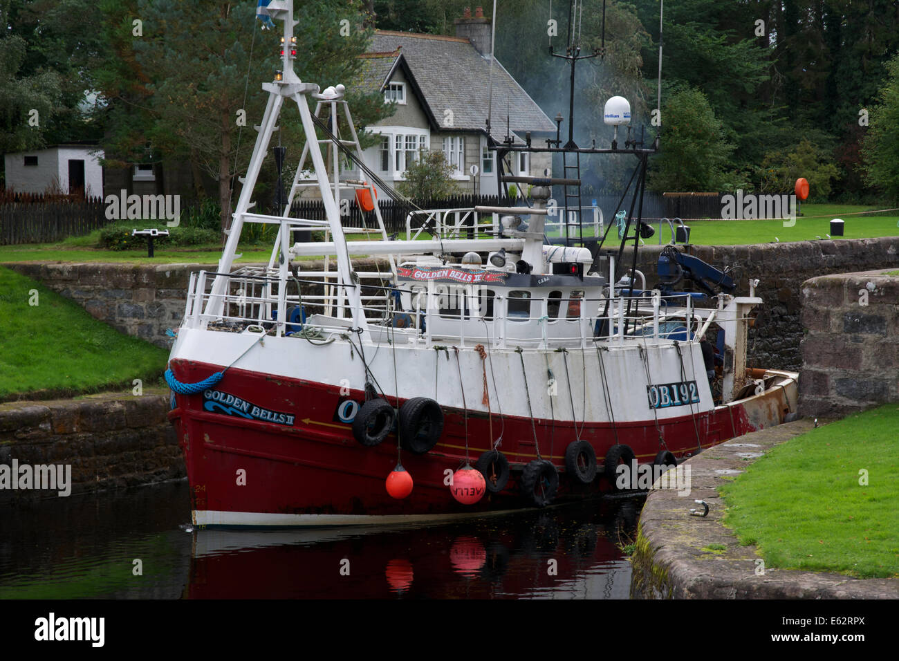 A trawler traversing the Caledonian Canal to Inverness Stock Photo - Alamy