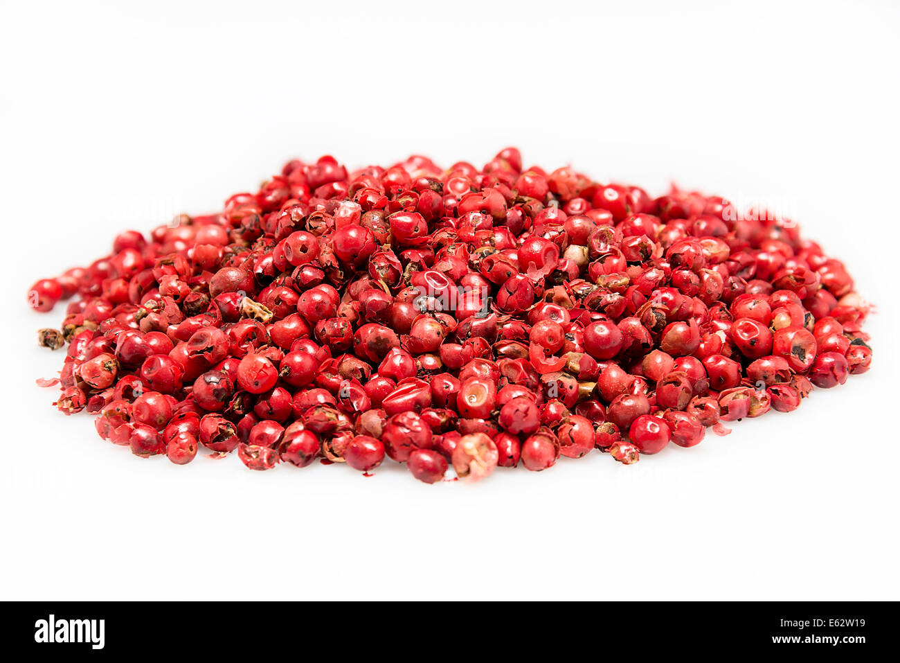 Red pepper seeds on a white background Stock Photo - Alamy