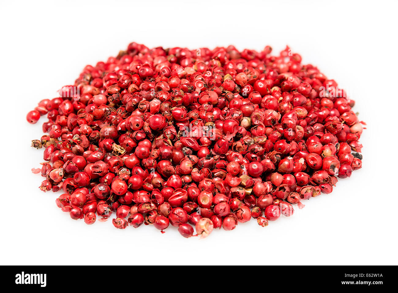 Red pepper seeds on a white background Stock Photo - Alamy
