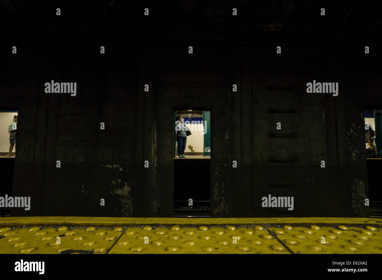 Manhattan, New York. People waiting for the subway as seen through ...