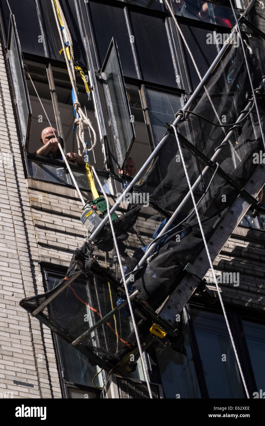 Manhattan, New York. Rescue workers attempt to retrieve a collapsed ...