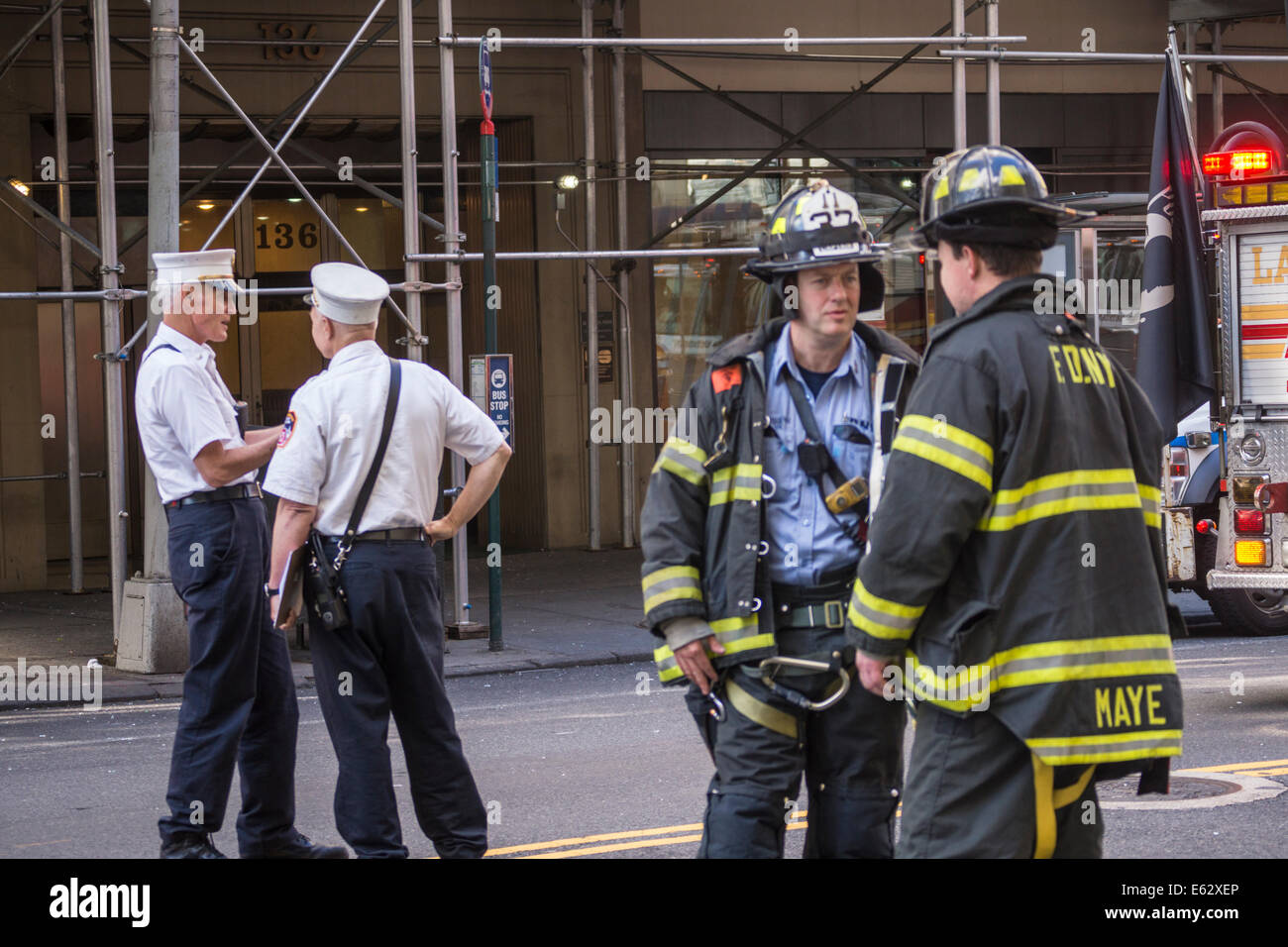 Manhattan, New York. Two Firefighters and Two hotel workers in the ...