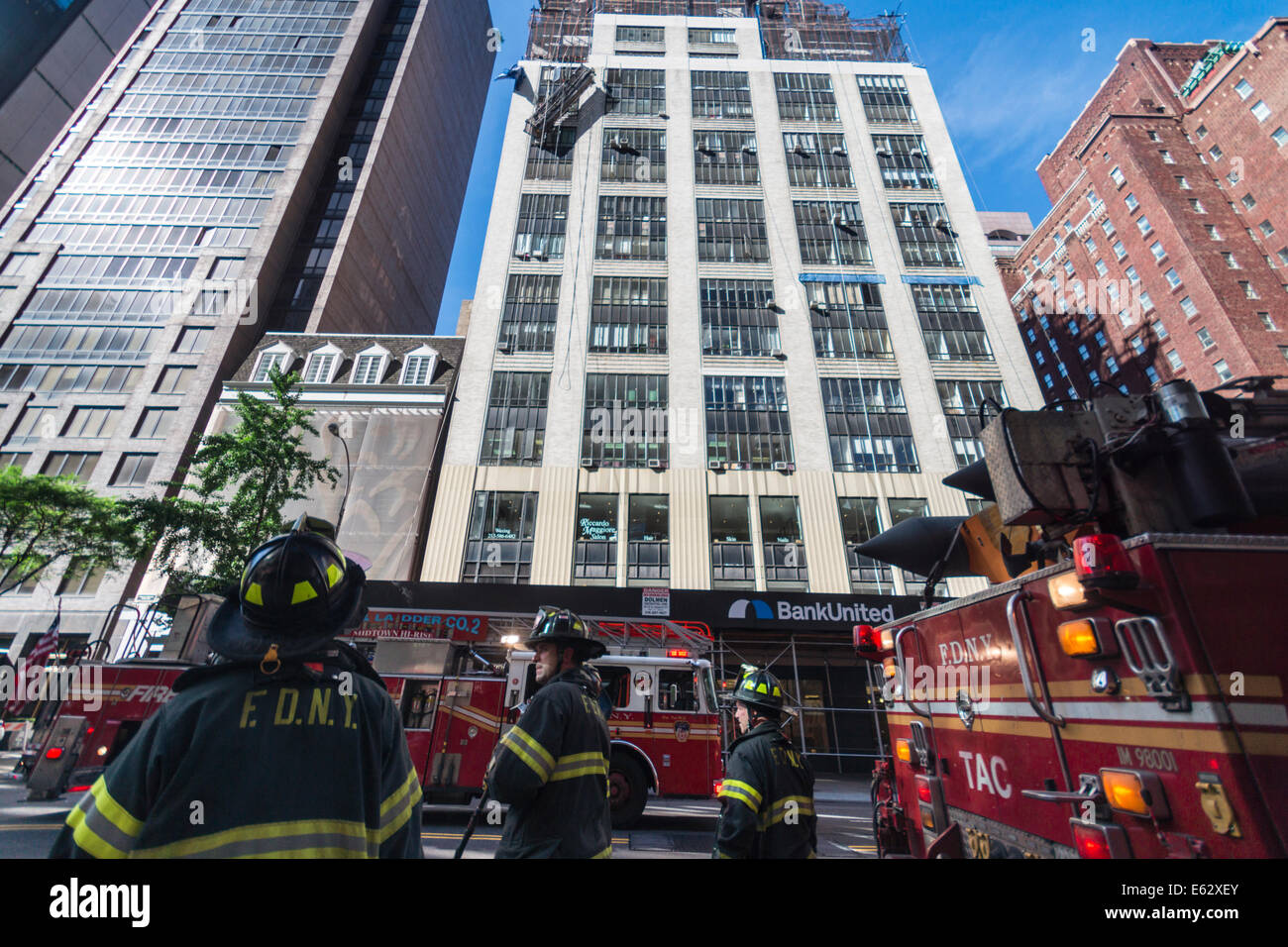 Manhattan, New York. Members of the Fire Department observe a work ...