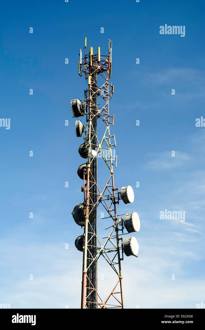 Two communication towers shot against blue sky Stock Photo - Alamy