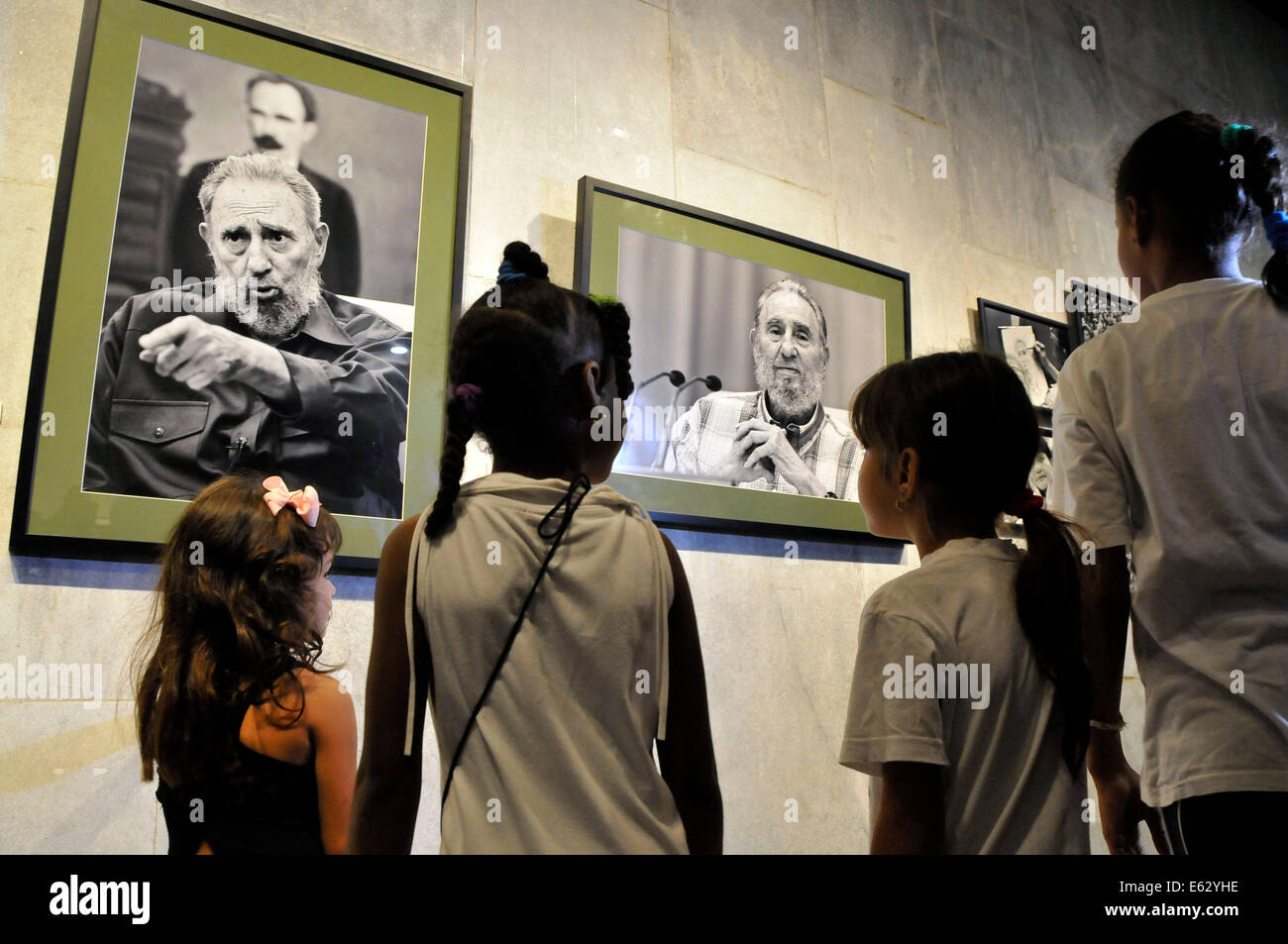 Havana, Cuba. 12th Aug, 2014. Visitors view photos of retired Cuban ...