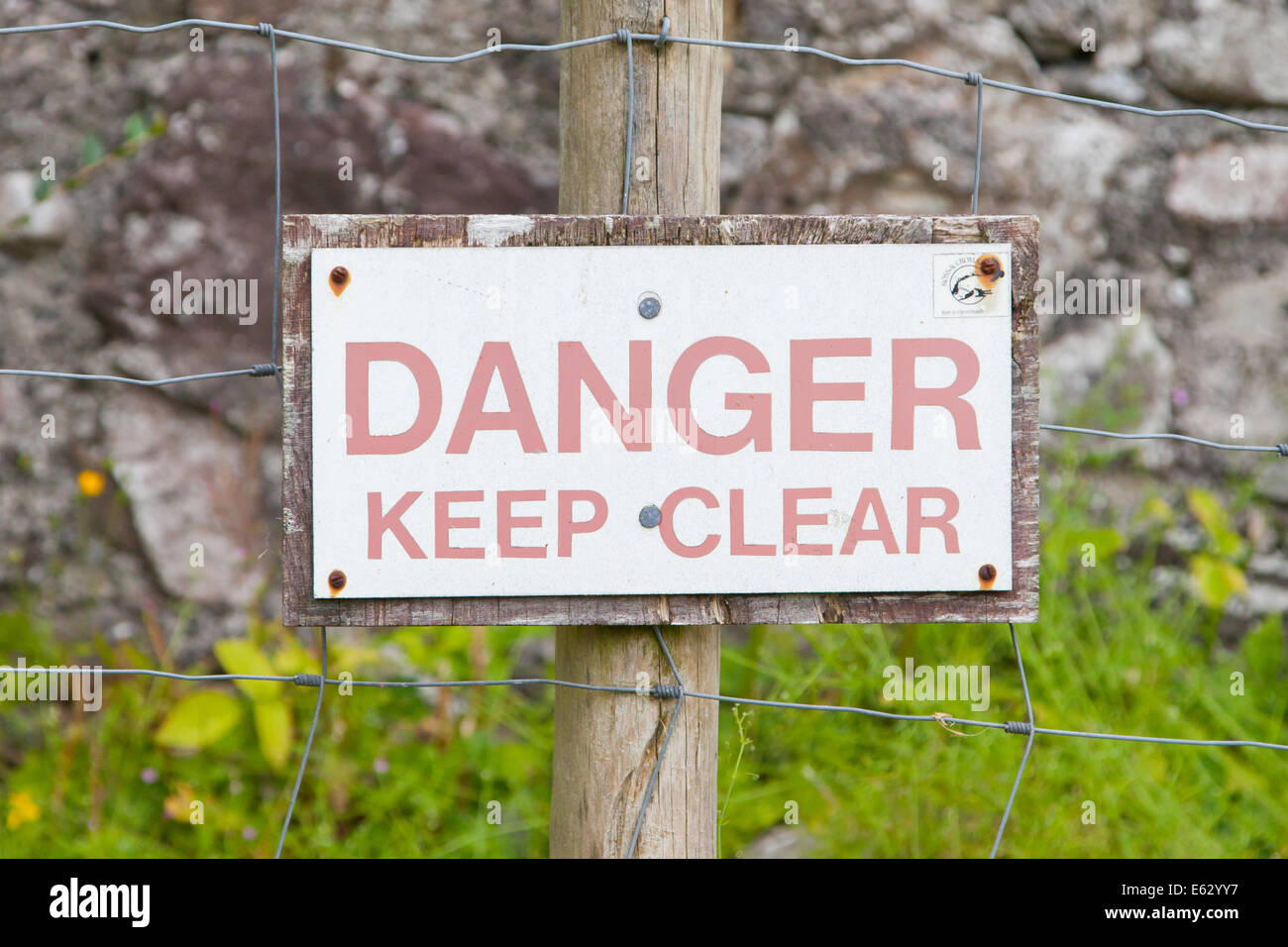 Warning Sign on a fence "Danger Keep Clear Stock Photo - Alamy