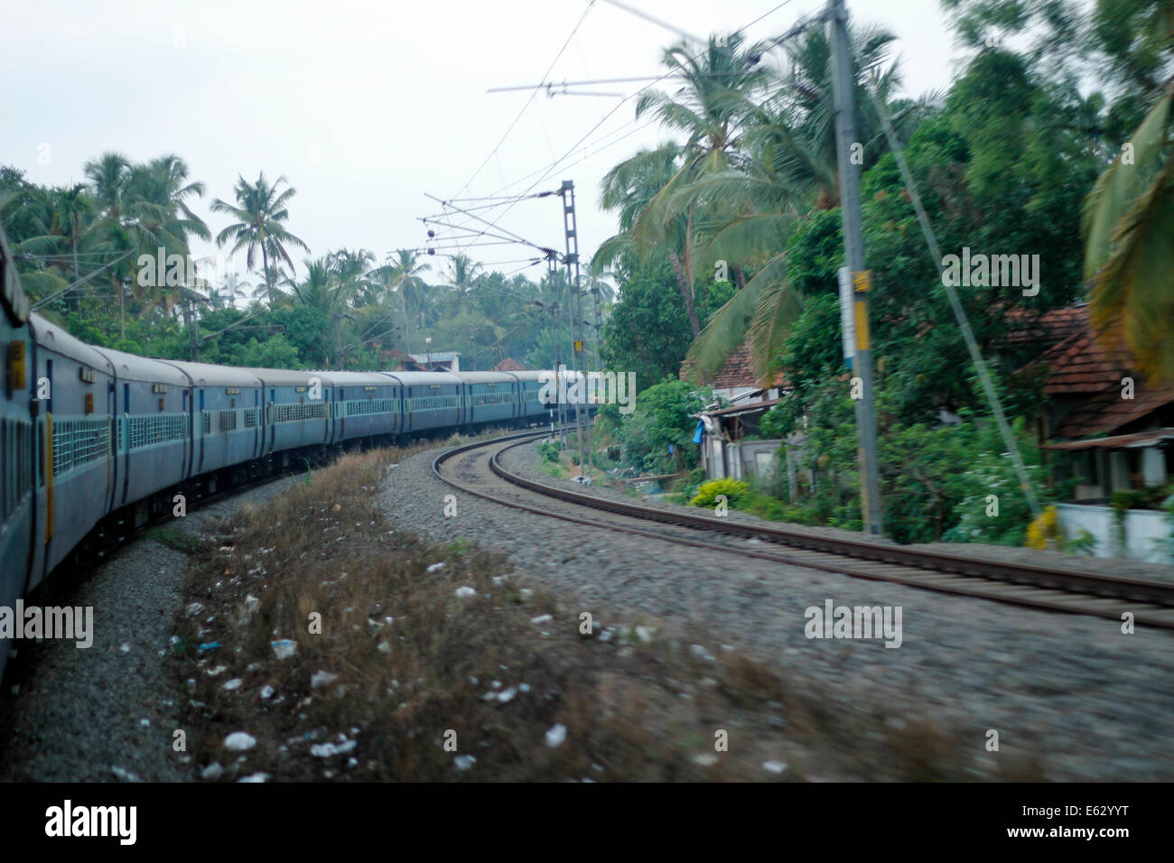 Indian railways train on a curve Stock Photo - Alamy