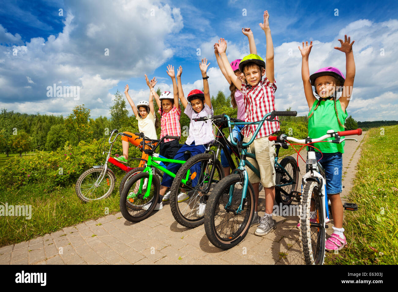 Children bicycle group diversity hi-res stock photography and images ...